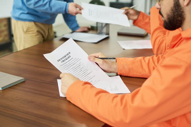 Inmate in Prison Uniform Studying Document during Class Stock Image ...