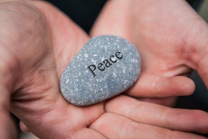 Inner Balance Concept: Hands Holding Stones with the Word Peace Stock ...