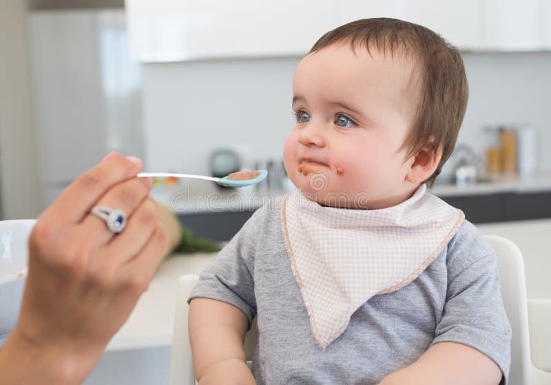 Innocent Baby Being Fed by Mother Stock Photo - Image of innocence ...