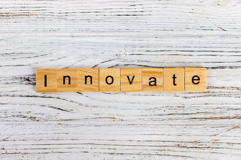 INNOVATE Word Made with Wooden Blocks on the Table Stock Photo - Image ...