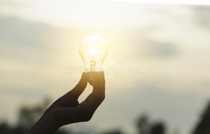 Innovation or Creative Concept of Hand Hold a Light Bulb and Copy Space ...