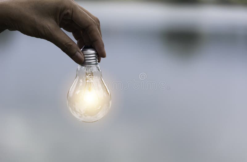 Innovation and Creative Concept of Hand Hold a Light Bulb and Copy ...