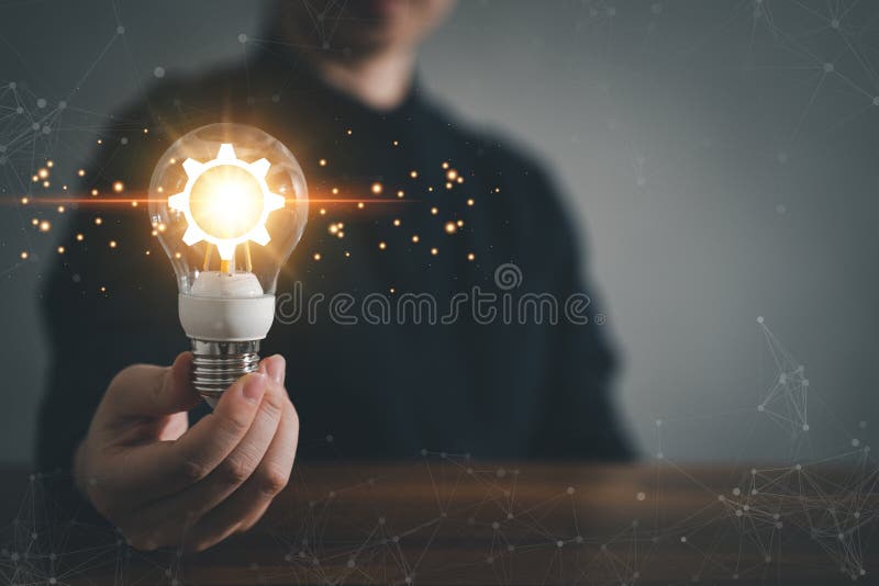 Innovation Design Concept. Hand Holding Light Bulb for New Idea Brain ...