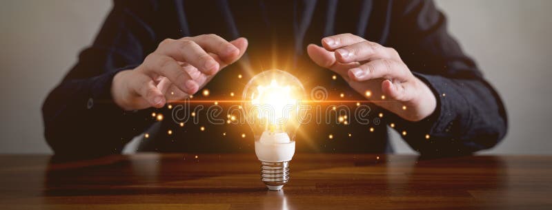 Innovation Design Concept. Hand Holding Light Bulb for New Idea Brain ...