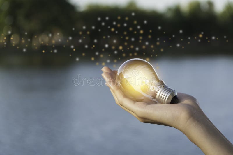 Innovation and Energy Concept of Hand Hold a Light Bulb and Copy Space ...