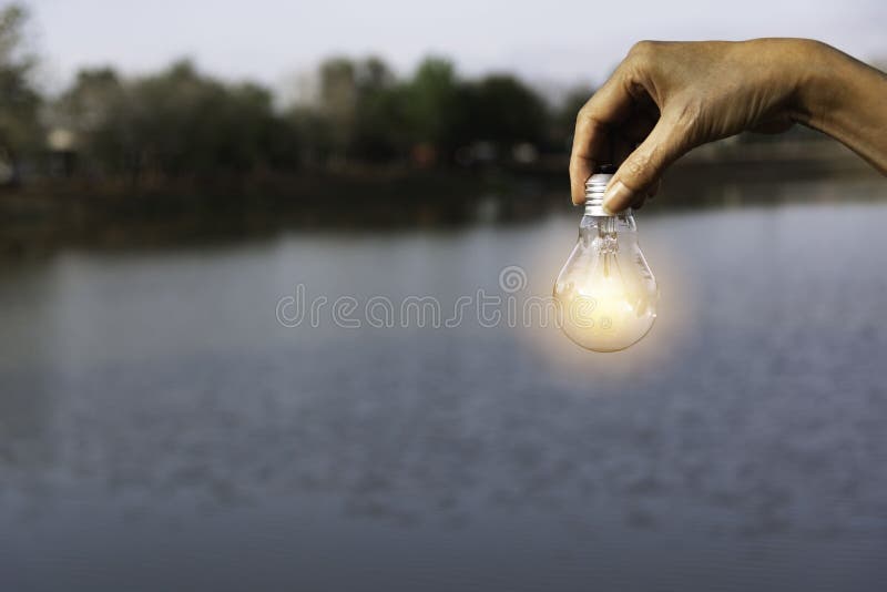 Innovation and Energy Concept of Hand Hold a Light Bulb and Copy Space ...
