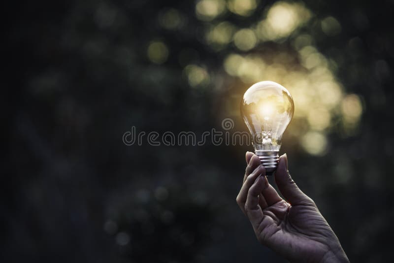 Innovation and Energy Concept of Hand Hold a Light Bulb and Copy Space ...