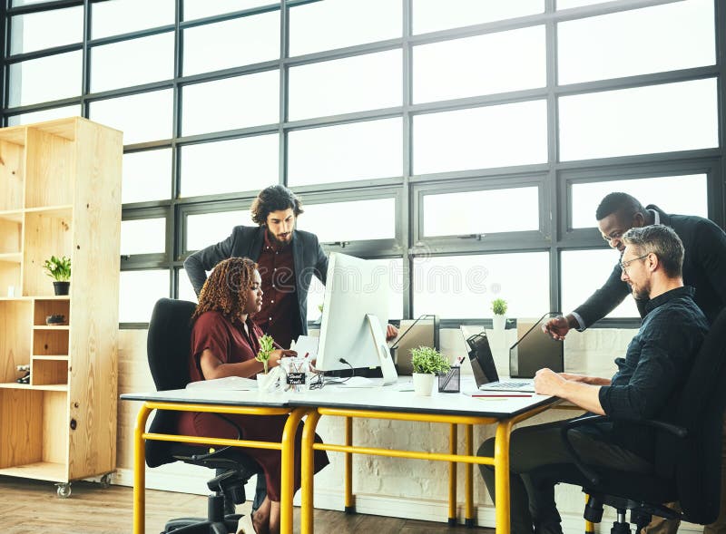 Innovation and Teamwork. a Group of Businesspeople Working in Their ...