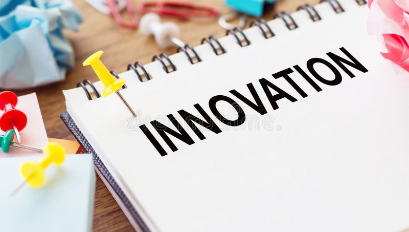INNOVATION Text on a Notebook on an Office Desk, Next To it Paper ...