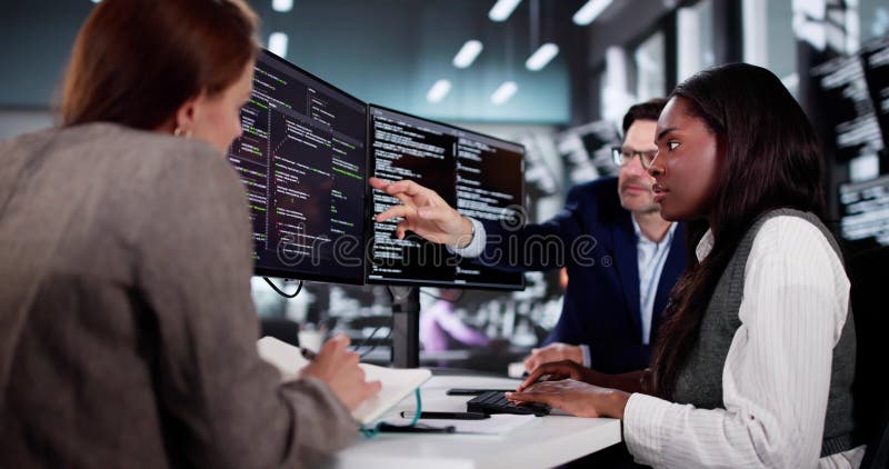 Innovative African Programmer Collaborating with Diverse Team Stock ...