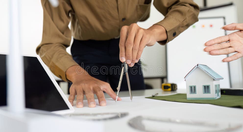 Innovative Design and Drafting Skills. Team Using Compasses To Map Out ...