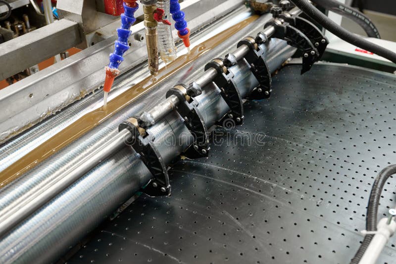 Innovative Glue Applicator in Action at a Manufacturing Facility during ...