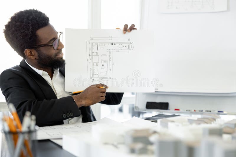Innovative Man Architect Presenting Blueprints on Presentation N His ...