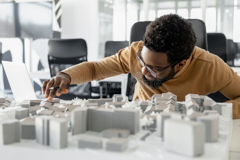 Innovative Man Architect Working on Construction Plans in the Office ...
