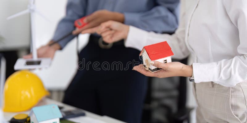 Innovative Models and Sustainable Engineering. Engineer Presenting a ...