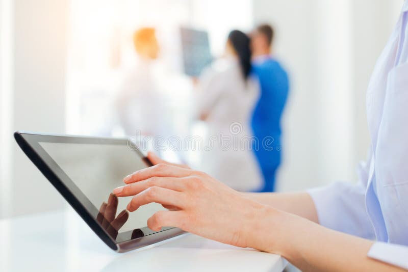 Close Up of Female Medical Worker Using Tablet Computer Stock Photo ...