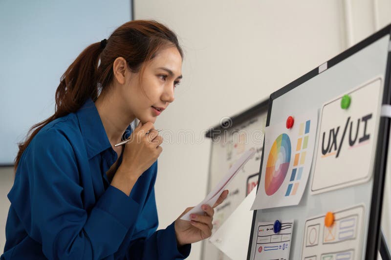 Innovative UX UI Design Discussion. a Designer Thoughtfully Examines a ...