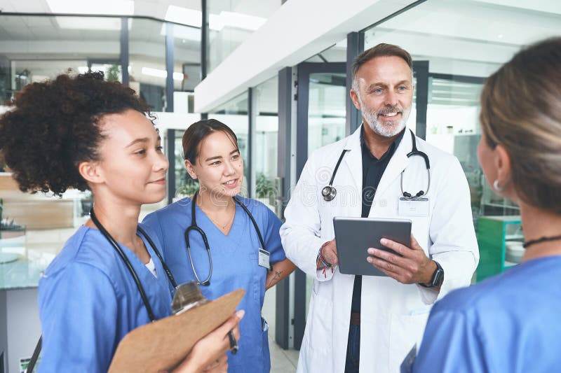 Lets Check that Temperature. a Young Doctor Wearing a Mask and Standing ...