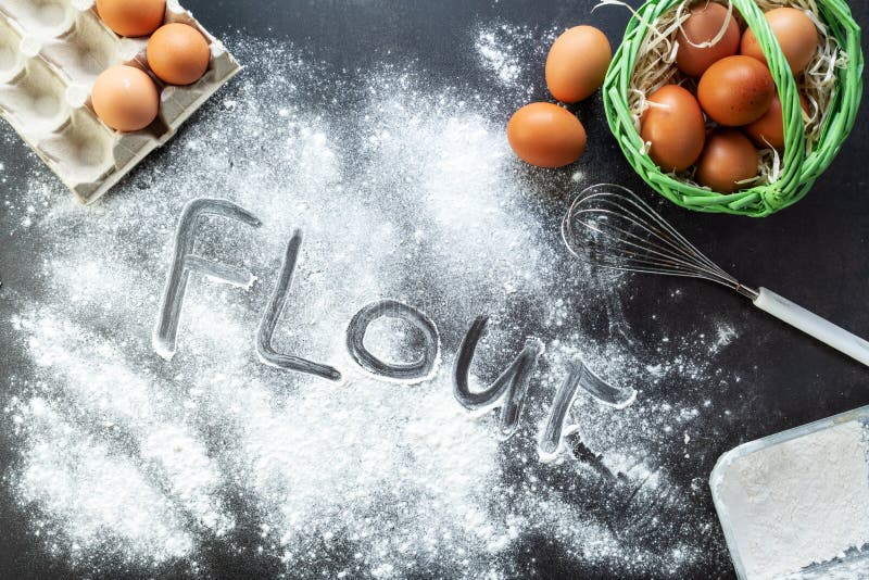 The Inscription Flour, on a Dark Background, the Word Flour, with Eggs ...