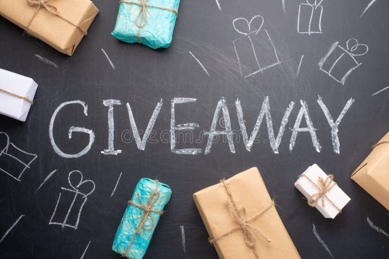 Inscription Giveaway Written on the Board with Gifts Stock Photo ...