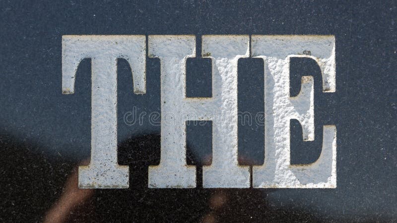 Close-up of Definite Article the on a Granite Wall. Stock Image - Image ...