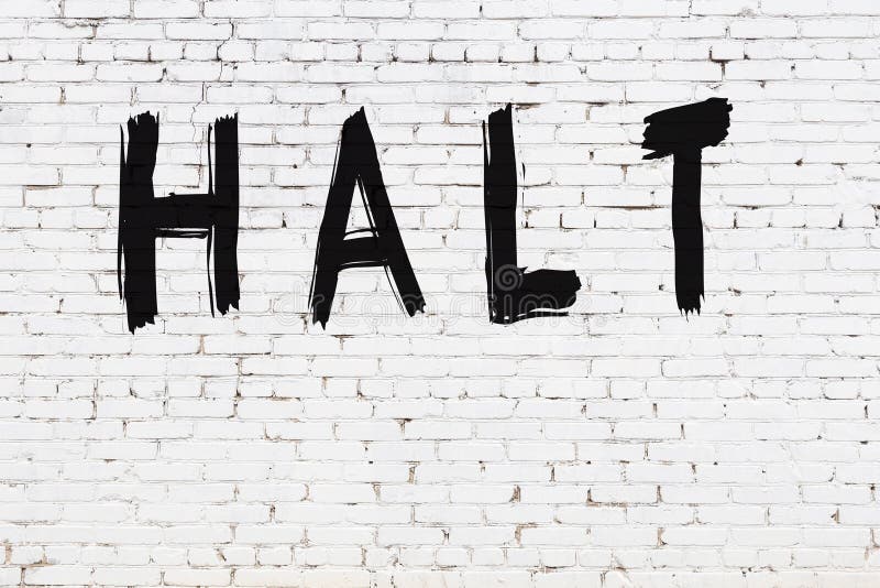 Inscription Halt Painted on White Brick Wall Stock Photo - Image of ...