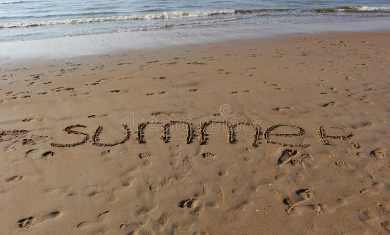 Inscription of `Summer`, Footprints in the Sand and Sea Waves at Sunset ...