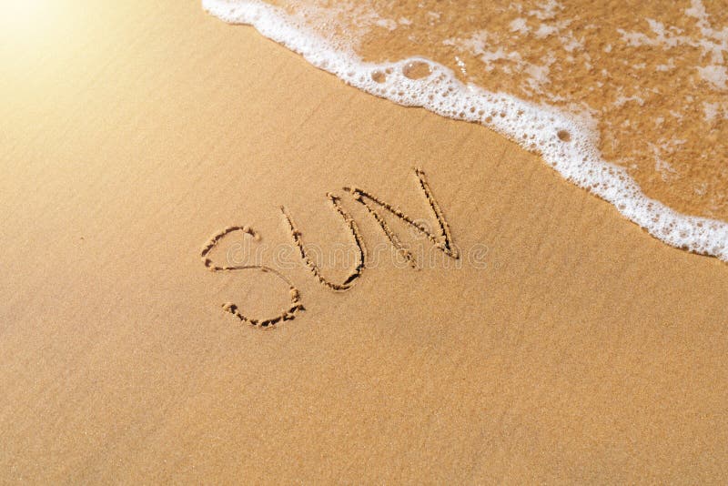 The Inscription Sun on the Sea Sand. Vacation Concept Stock Image ...