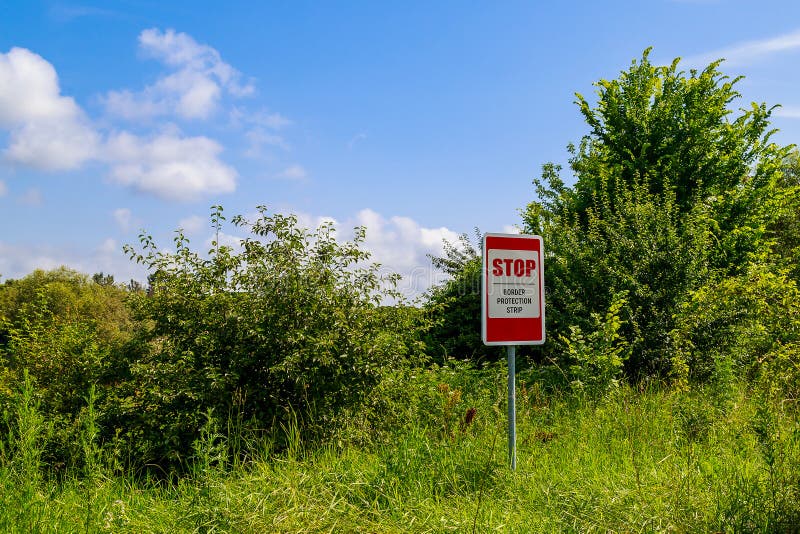 The Inscription or Text in English STOP BORDER PROTECTION STRIP ...