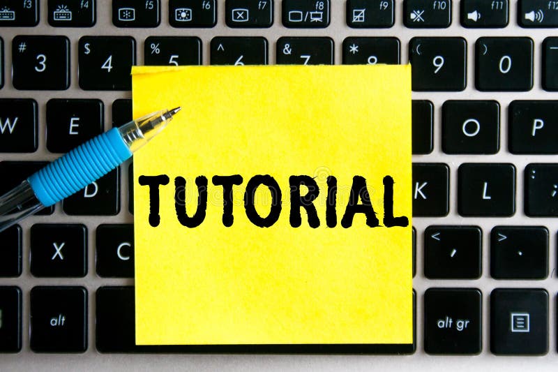Inscription `TUTORIAL` on a Yellow Sheet of Sticker Paper on the ...