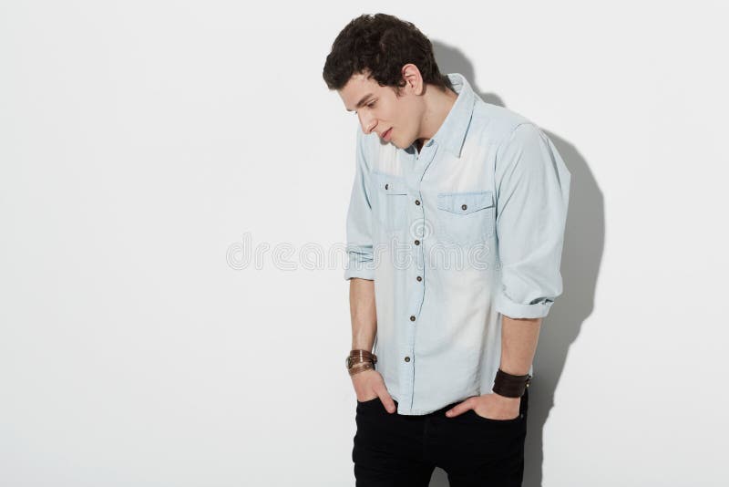 Insecurity. an Attractive Male Standing Awkwardly with His Hands in His ...