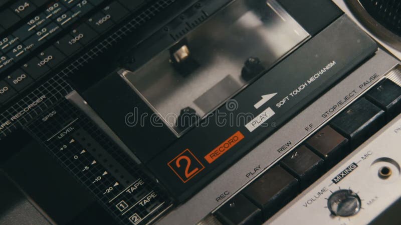 Insert an Audio Cassette into a Tape Player and Playback Stock Footage ...