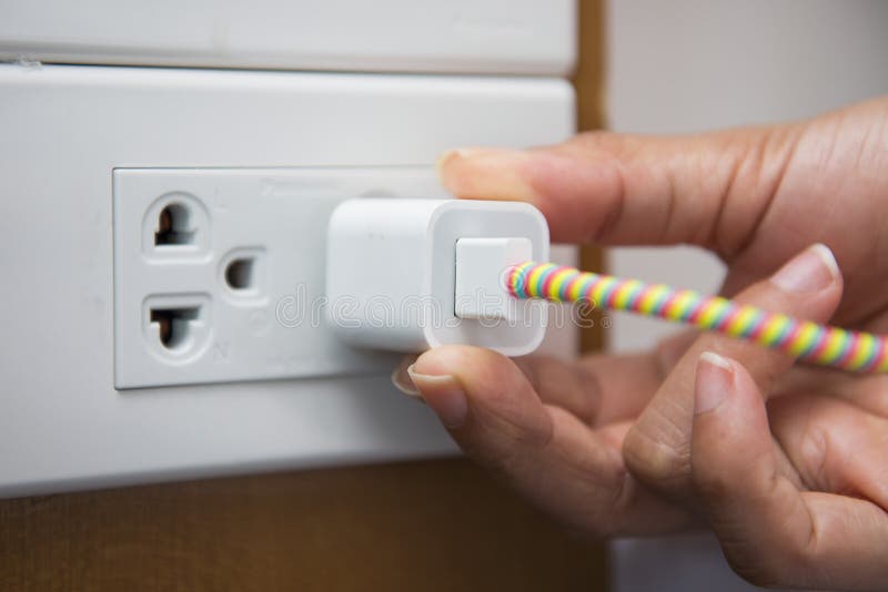 Insert Charger into Wall Outlet Stock Image - Image of mobile, plug ...