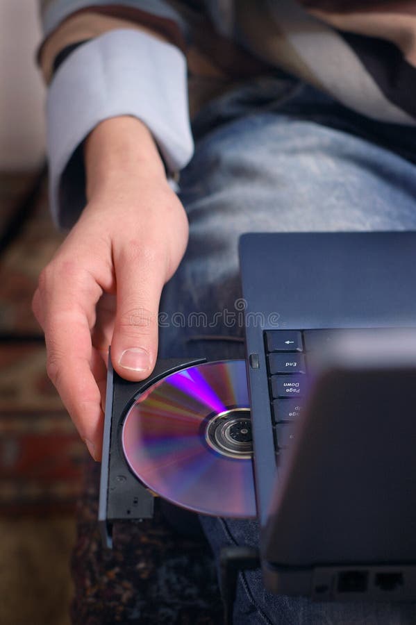 Inserting the CD stock image. Image of insert, holding - 168901