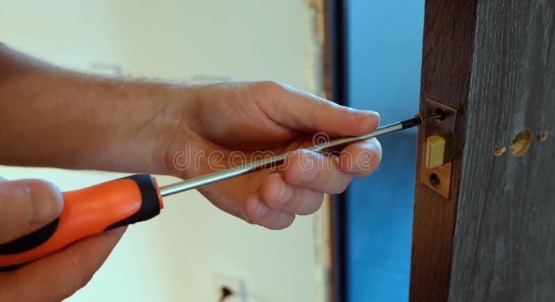 Insert of Latch and Handle into the Interior Door. Close-up View of the ...