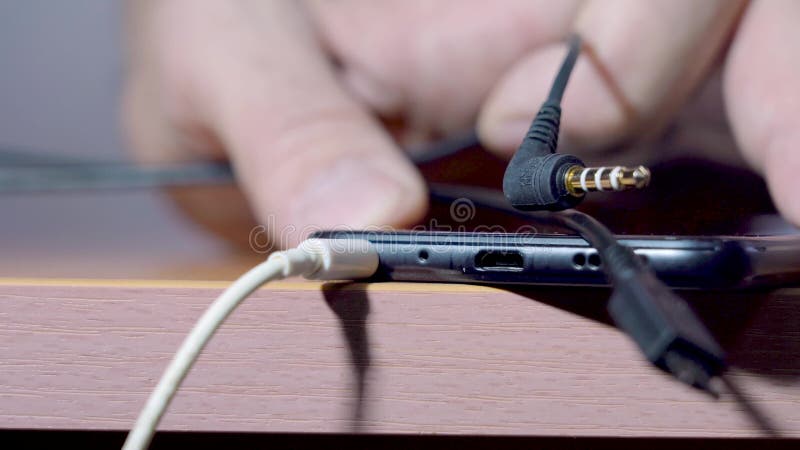 Insert and Pull Out the Plug of the Audio Jack Smartphone. Connecting ...