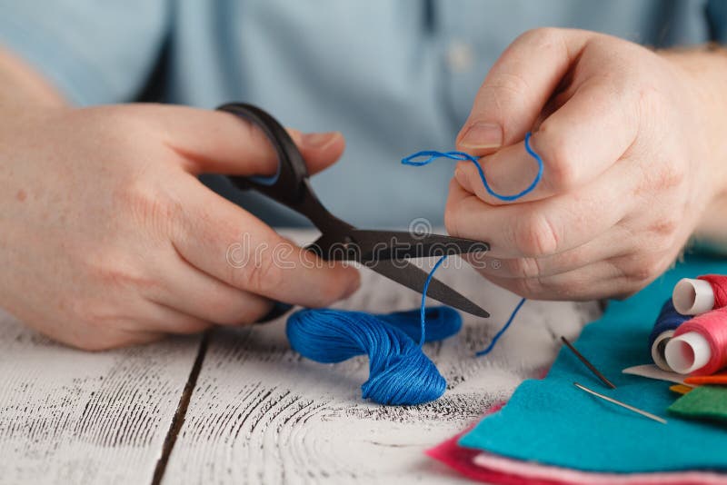 Insert the Thread in Needle by Man Hand Stock Image - Image of ...