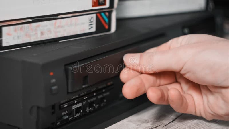 Insert VHS Cassette into VCR Player and Push Play Button Stock Video ...