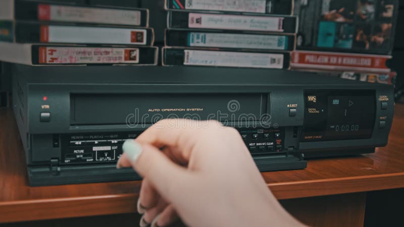 Insert VHS Cassette into VCR and Push Play Button Stock Video - Video ...