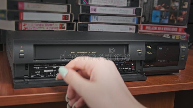 Insert VHS Cassette into VCR and Push Play Button Stock Video - Video ...