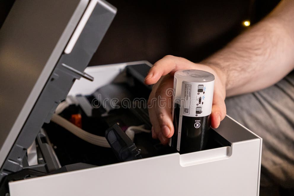 Inserting Black Ink Bottle into Printer Refill Tank with Clear ...