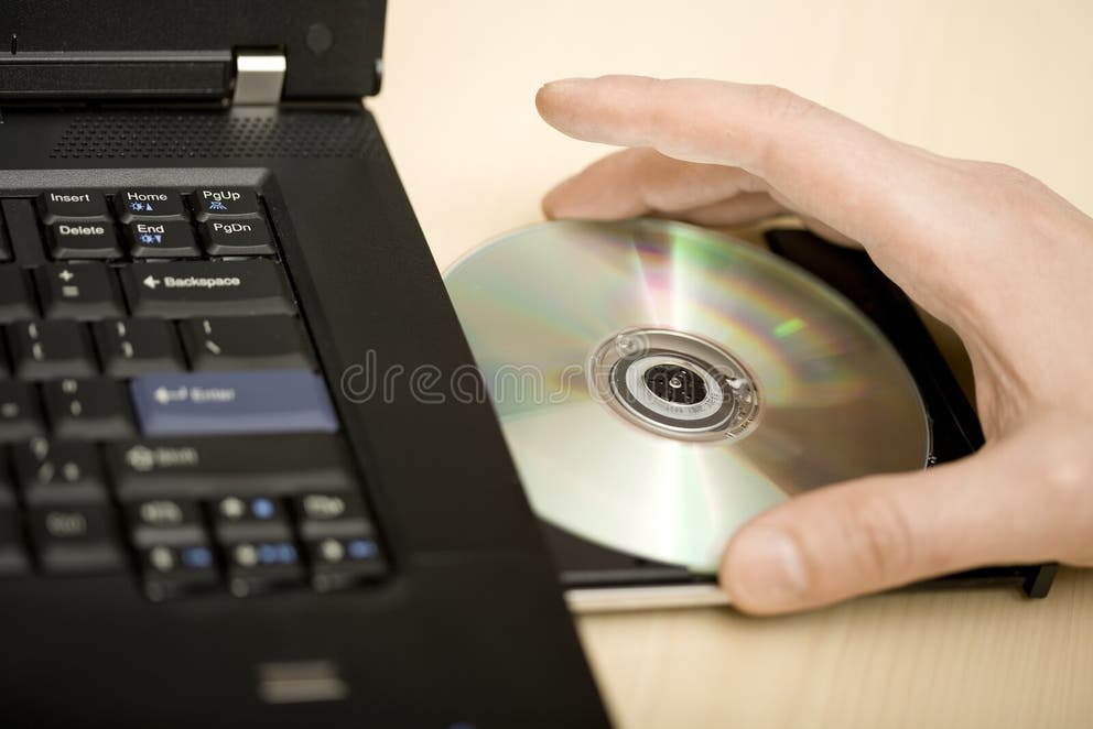 Inserting a cd stock image. Image of office, drive, movie - 4533507
