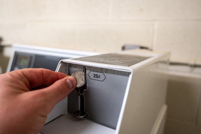 Inserting a Coin into a Washing Machine Stock Photo - Image of drier ...