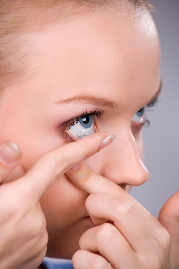 Inserting a contact lens stock photo. Image of optical - 17505000