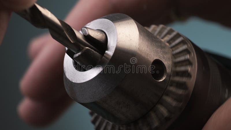 Inserting Drill Bit into Chuck of Hand Drill. Stock Photo - Image of ...