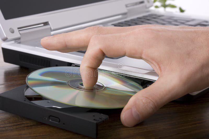 Inserting a DVD stock image. Image of music, disk, finger - 7689483