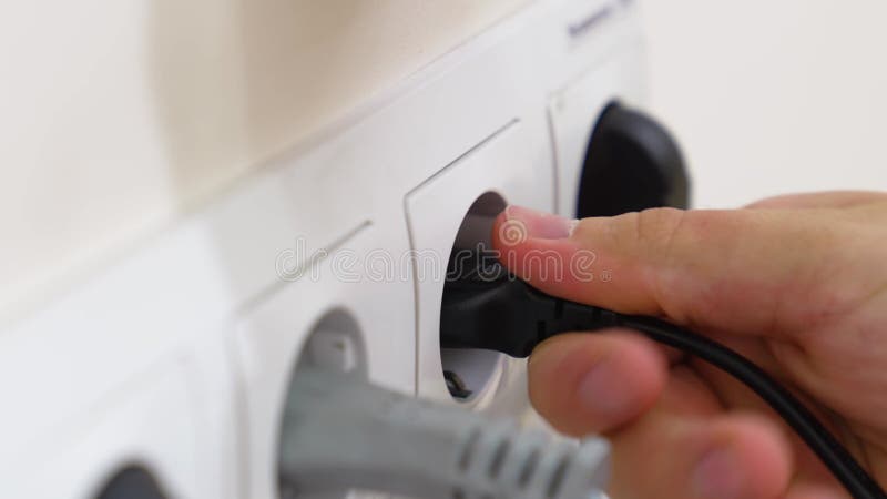 Inserting the Electrical Plug into the Socket. Stock Footage - Video of ...
