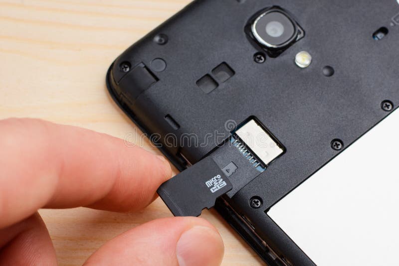 Inserting Memory Card To a Mobile Phone Stock Image - Image of open ...