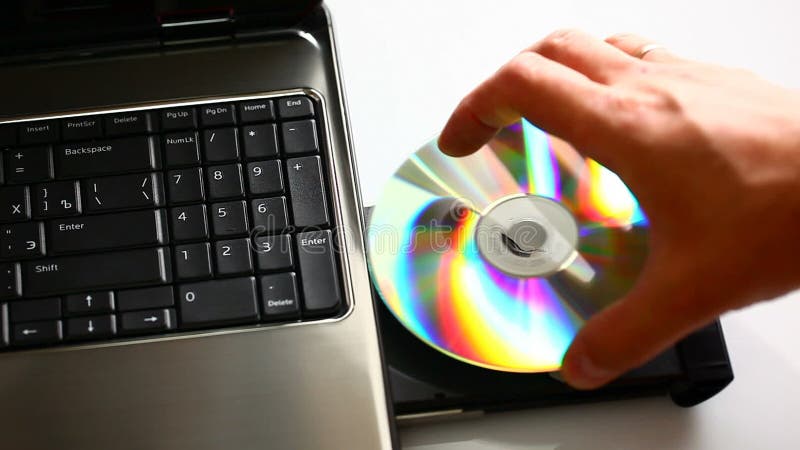 Inserting Optical Disc. stock video. Video of keyboard - 38273812