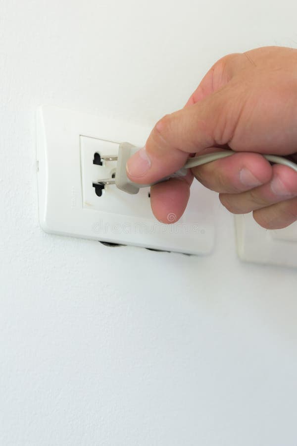 Inserting plug in outlet. stock photo. Image of input - 80401916